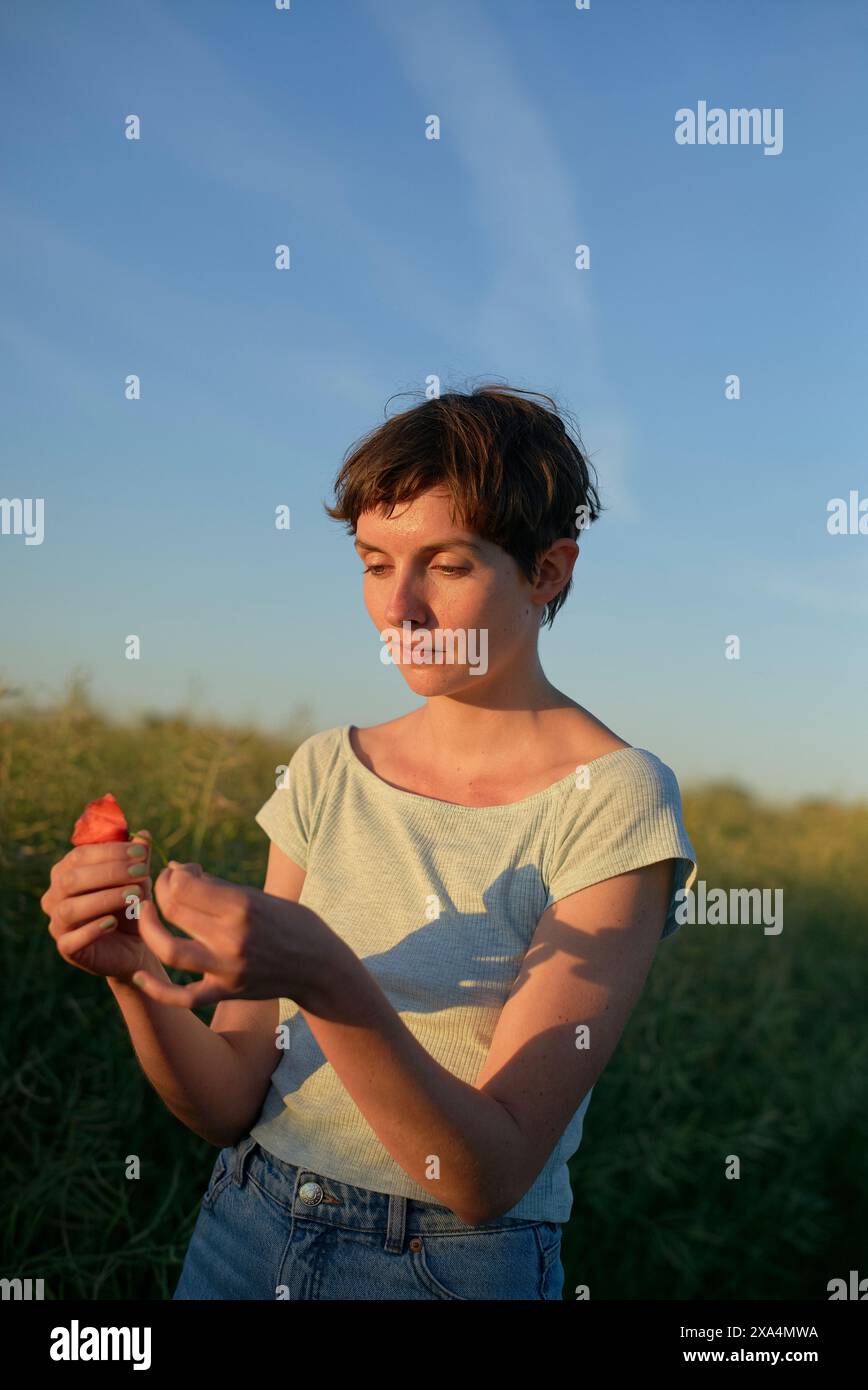 Woman holding object hi-res stock photography and images - Alamy