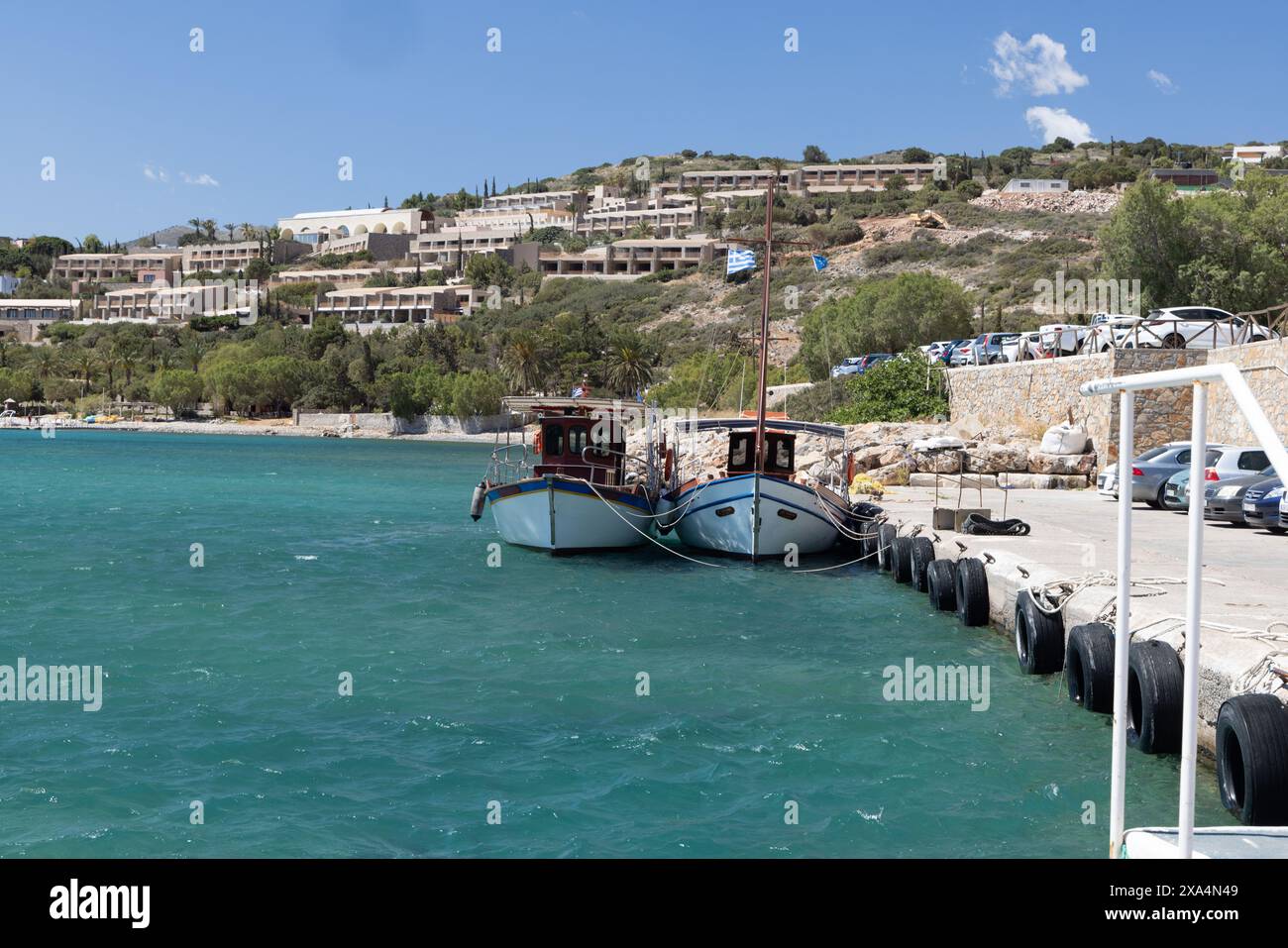 Ferries for Spinalonga wait for passengers at the jetty at Plaka in ...