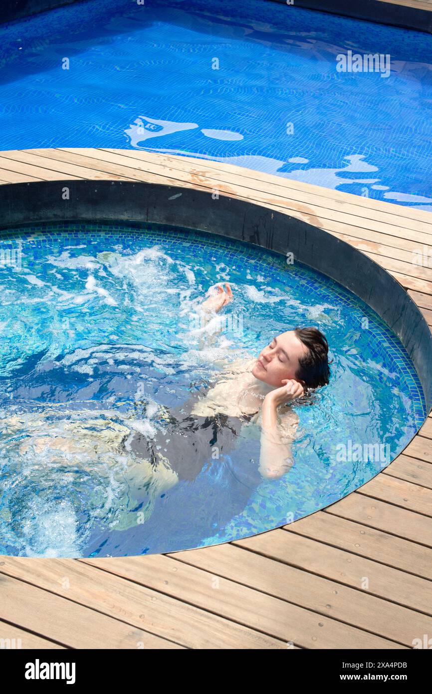 Surrounded by wooden deck larger pool background hi-res stock ...