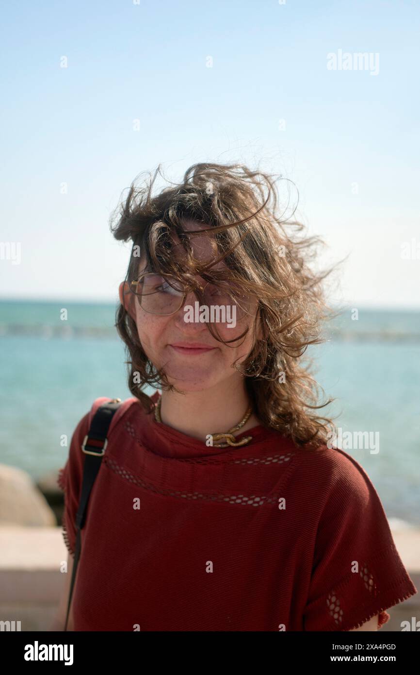 Woman standing tousled hair hi-res stock photography and images - Alamy