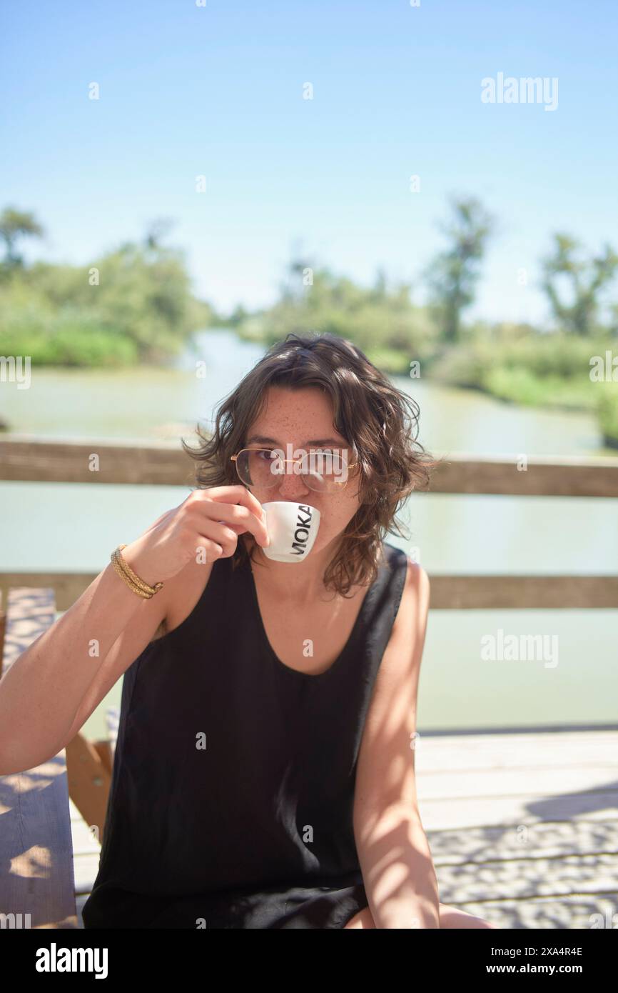 Sits outside hi-res stock photography and images - Alamy