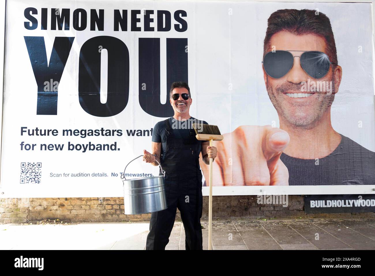 EDITORIAL USE ONLY Simon Cowell 'installs' a billboard in London as he ...