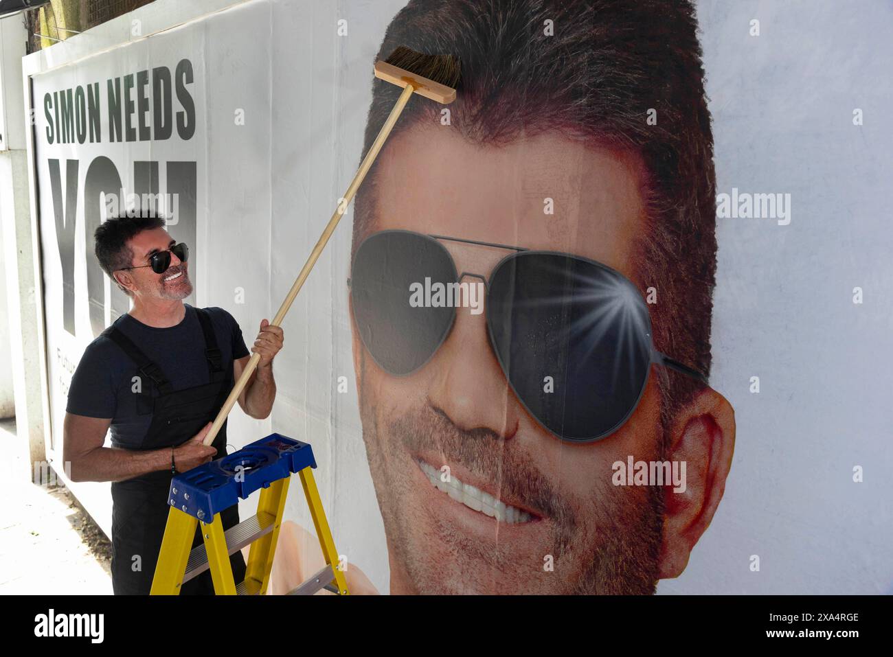 EDITORIAL USE ONLY Simon Cowell 'installs' a billboard in London as he ...