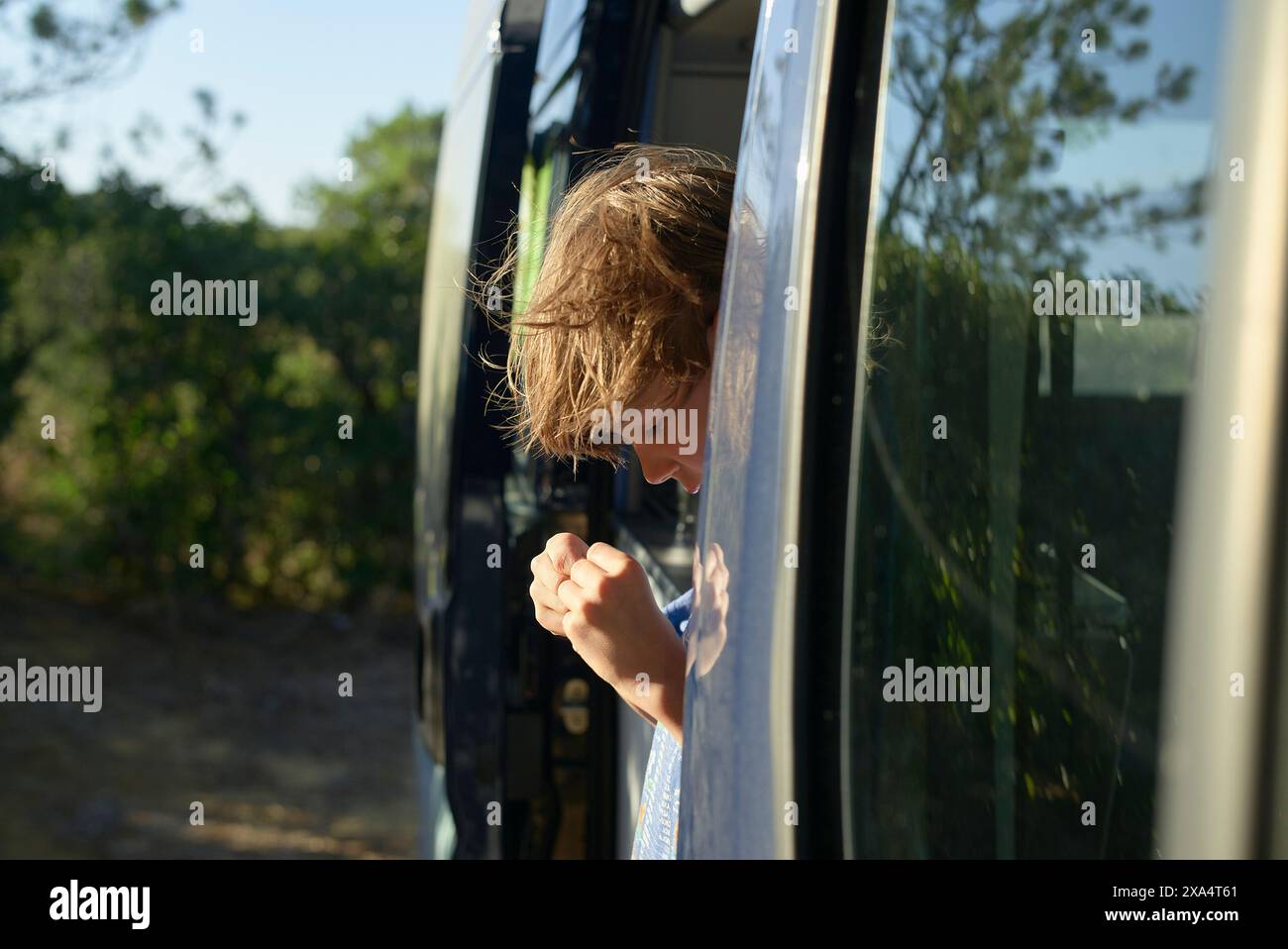Child peeks out behind vehicle door hi-res stock photography and images ...