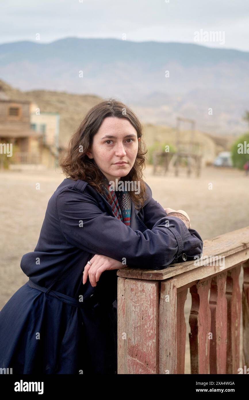 Woman leans on fence hi-res stock photography and images - Alamy