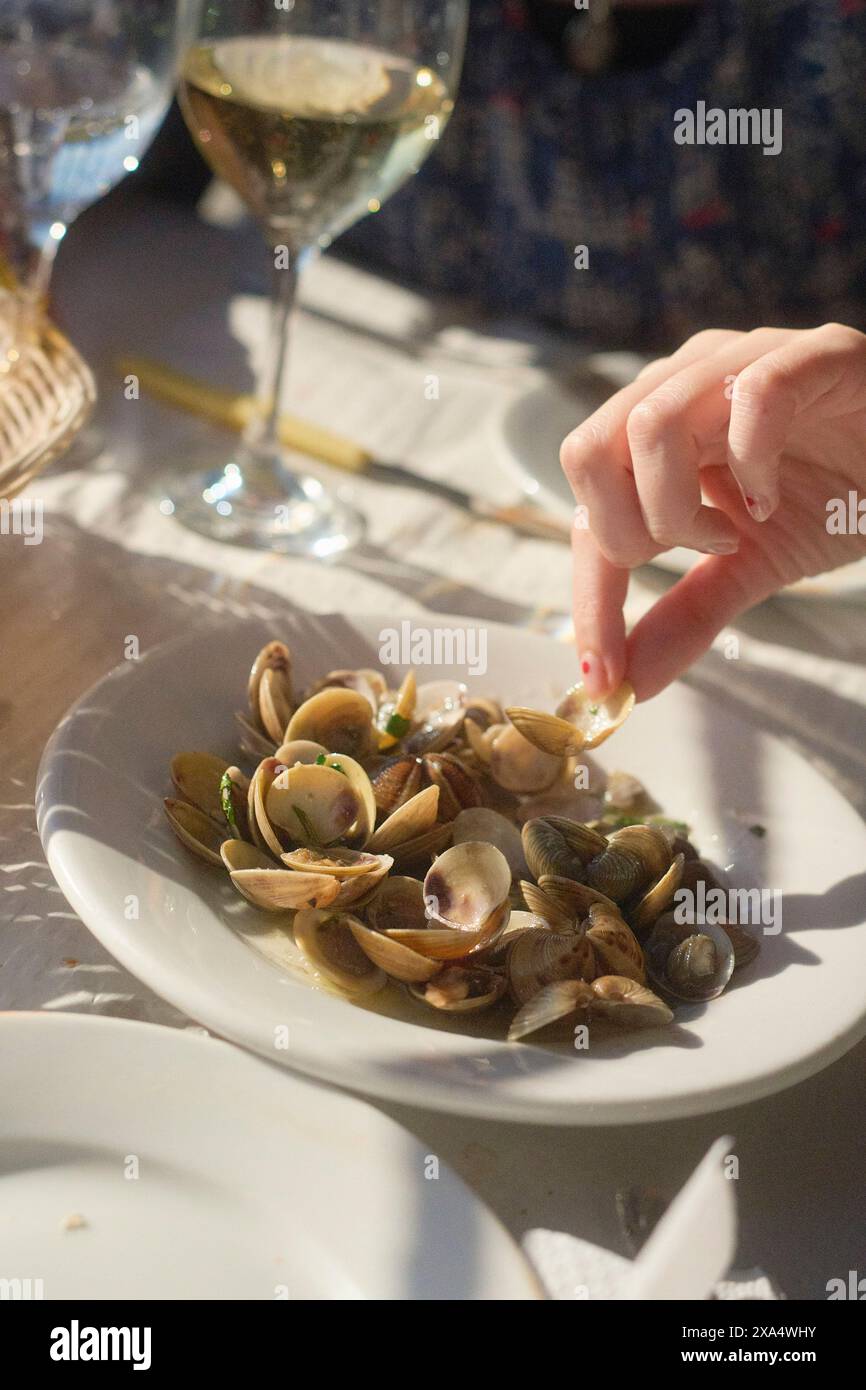 Female eating clams hi-res stock photography and images - Alamy