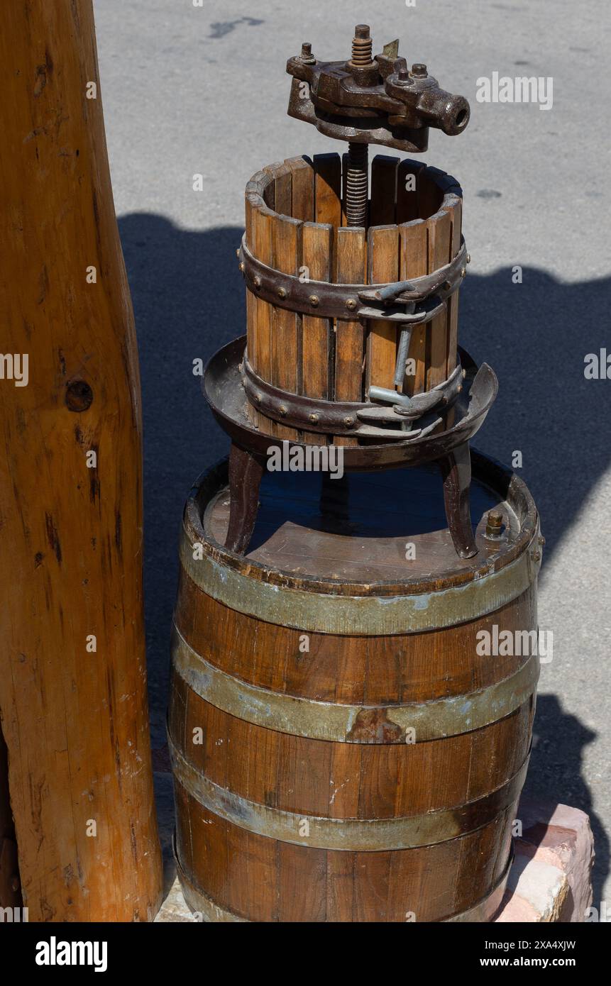 Wine press from the old days using a mechanical device (without a ...