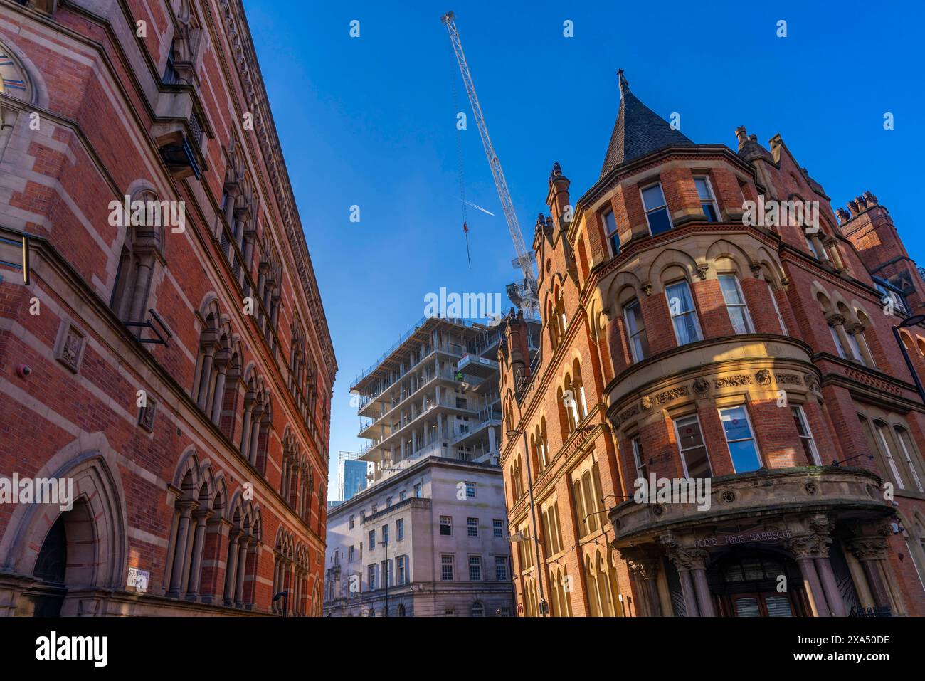 View of red brick architecture and new building on Albert Square ...