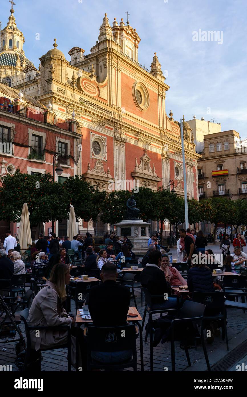 Seville, Spain. February 4, 2024 - A group of people sitting at cafe ...