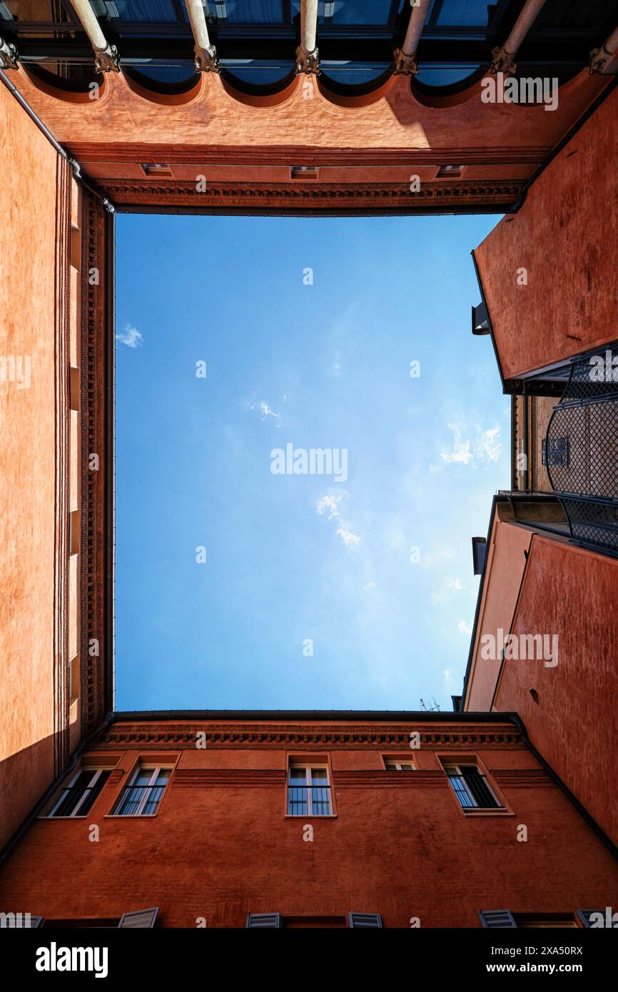 An upward view of the sky from a courtyard in Modena, Italy Stock Photo ...