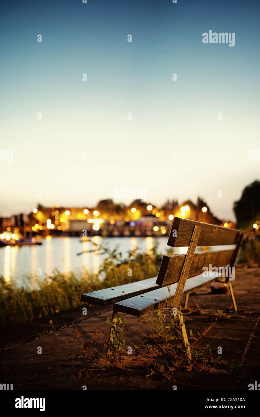A bench at dusk in Amsterdam Stock Photo - Alamy