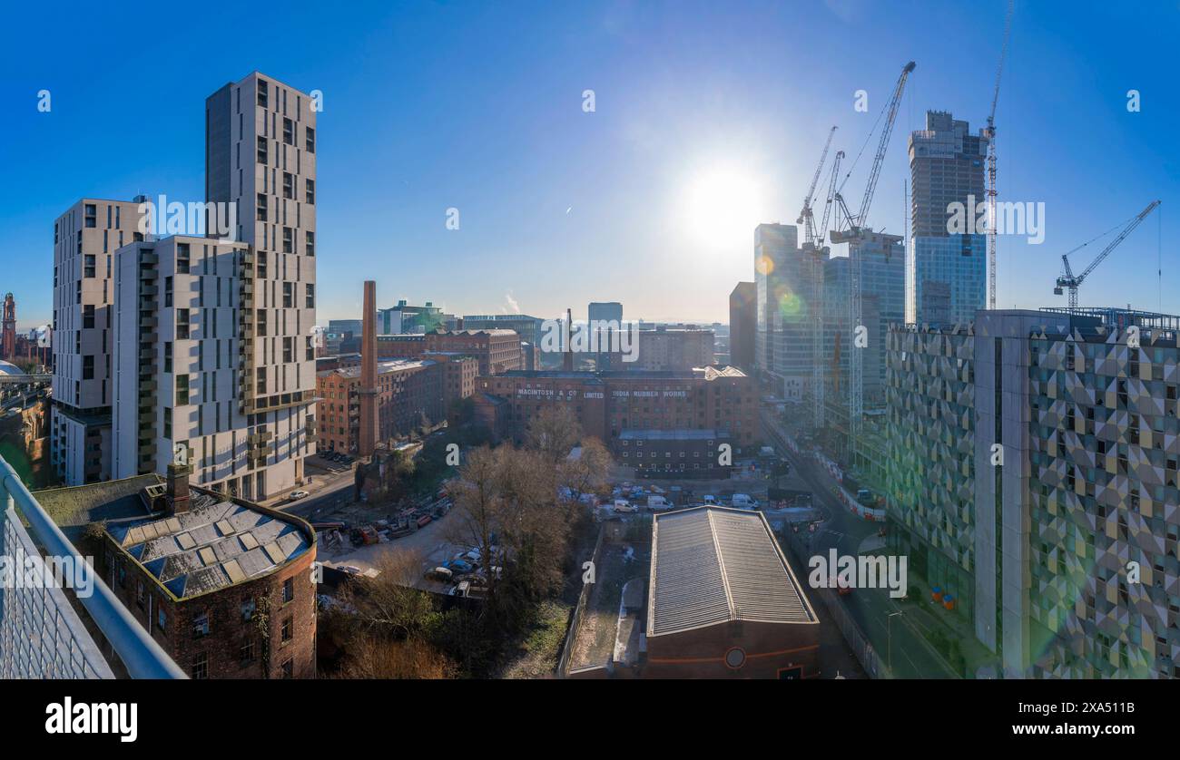 Elevated view of city skyline and cranes from Tony Wilson Place ...
