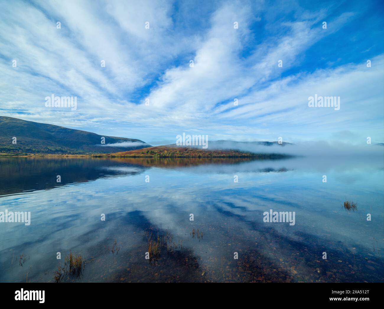 Surrounded by hills thin layer mist above water loch lochy hi-res stock ...