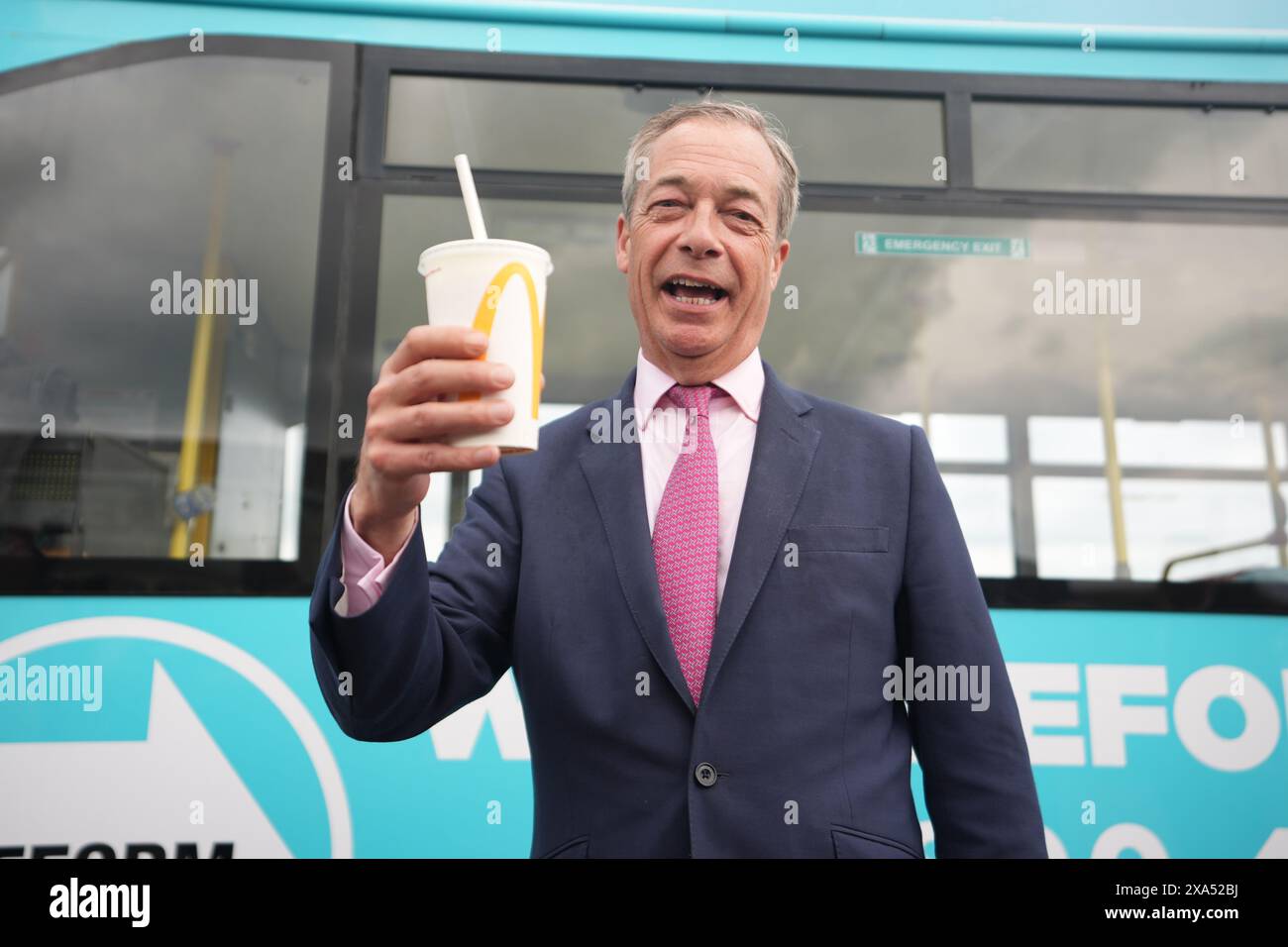 Leader of Reform UK Nigel Farage holding a McDonalds banana milkshake ...
