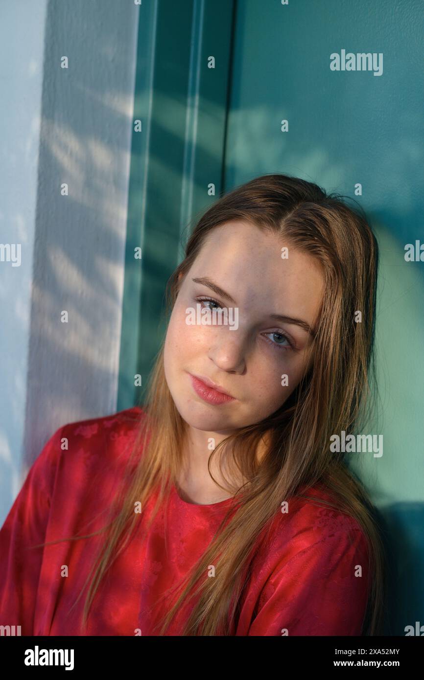 Woman leaning against glass window hi-res stock photography and images ...