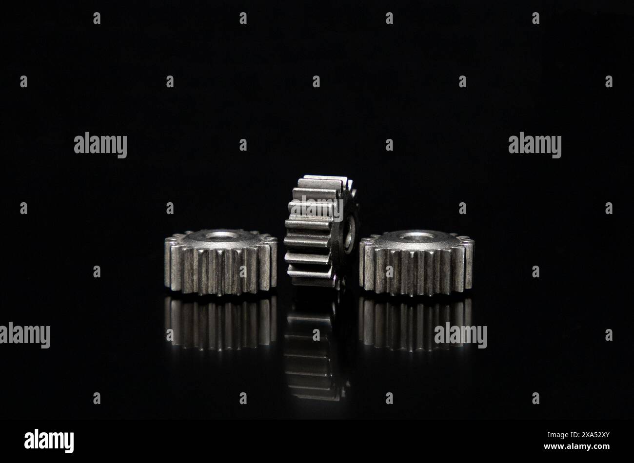 A decorative shot with three cogwheels on a black background Stock ...