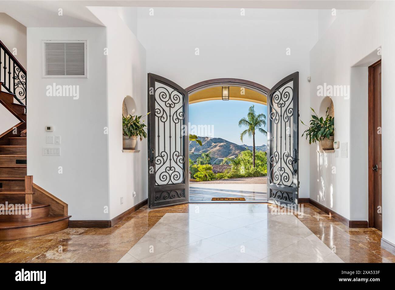 Luxurious mountain home entrance with marble floors Stock Photo - Alamy