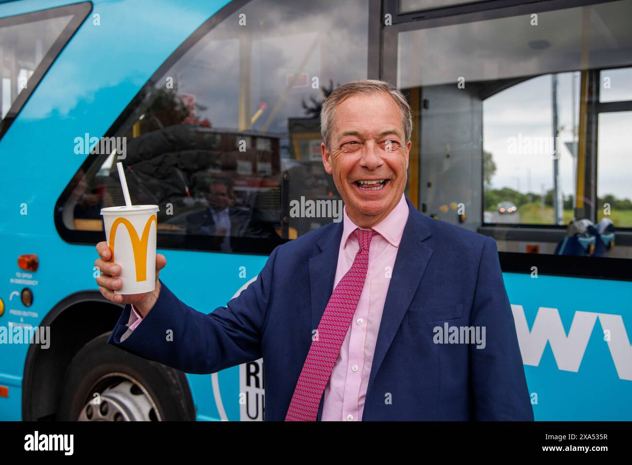 London, UK. 4th June, 2024. Nigel Farage drinks a banana milkshake ...