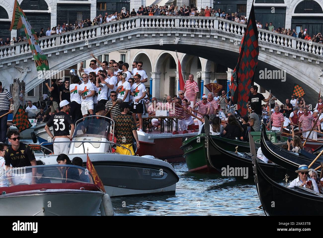 Venezia players celebrate promotion to Serie A with fans on the Grand ...