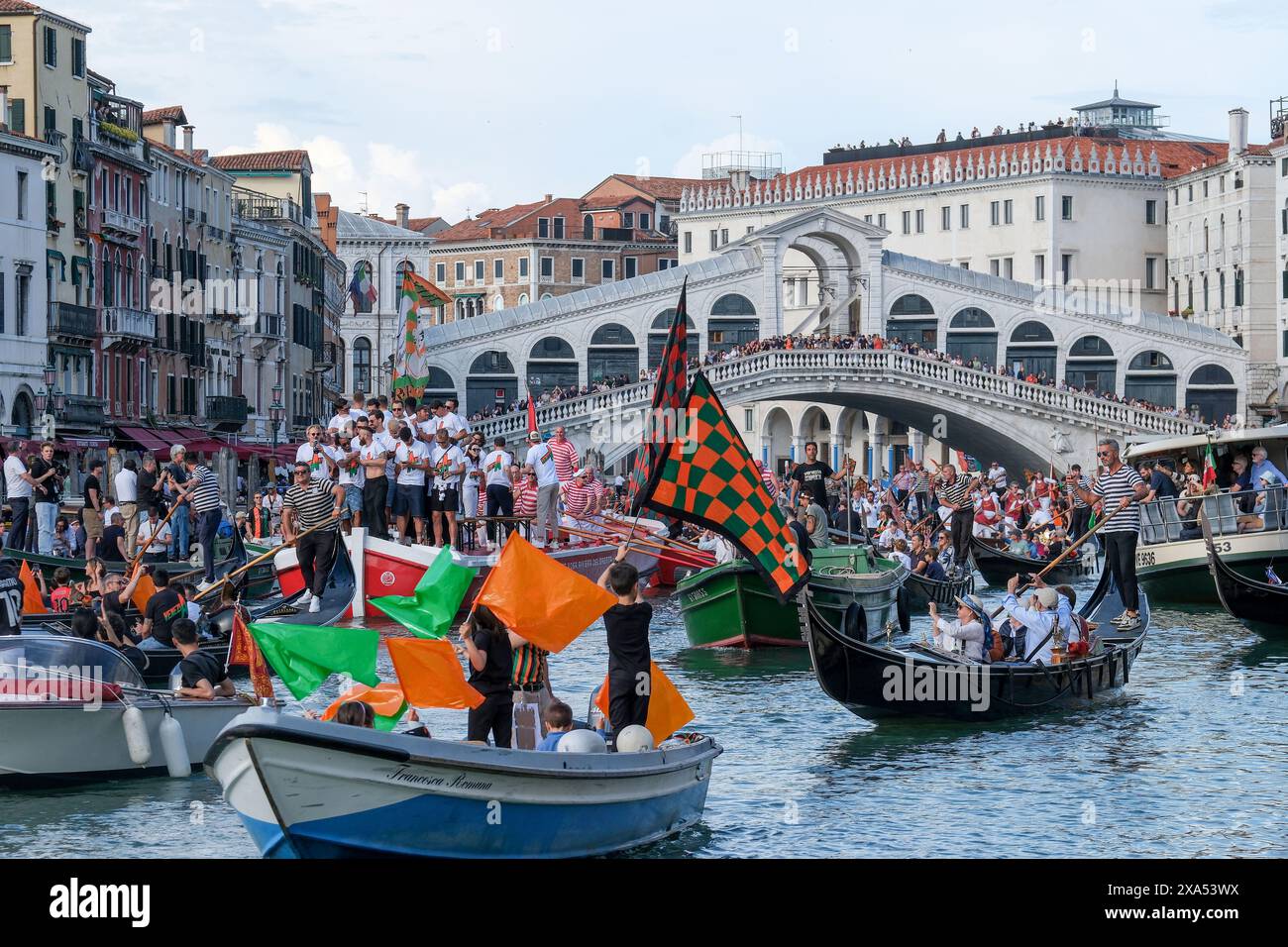 Venezia players celebrate promotion to Serie A with fans on the Grand ...