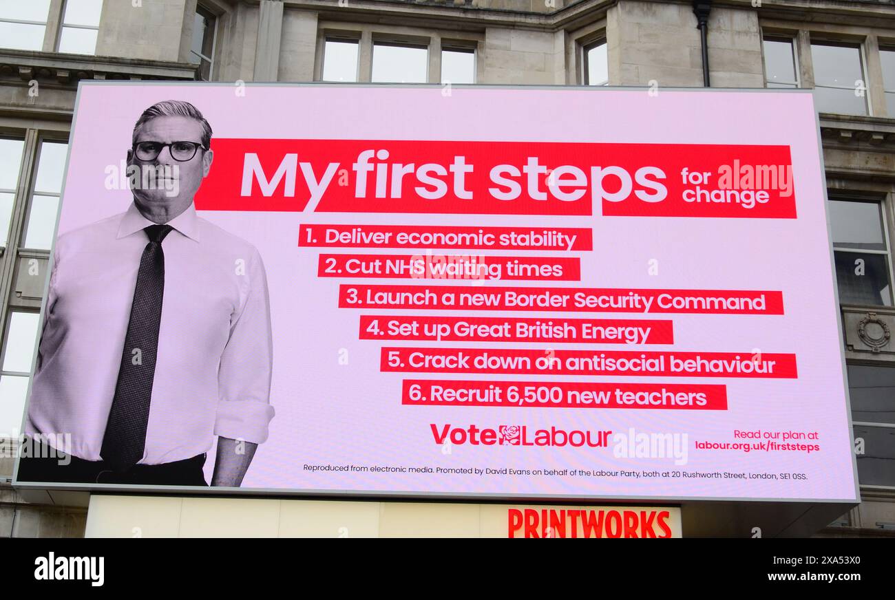 Electronic billboard in Manchester, UK, lists Labour Party 'my first ...