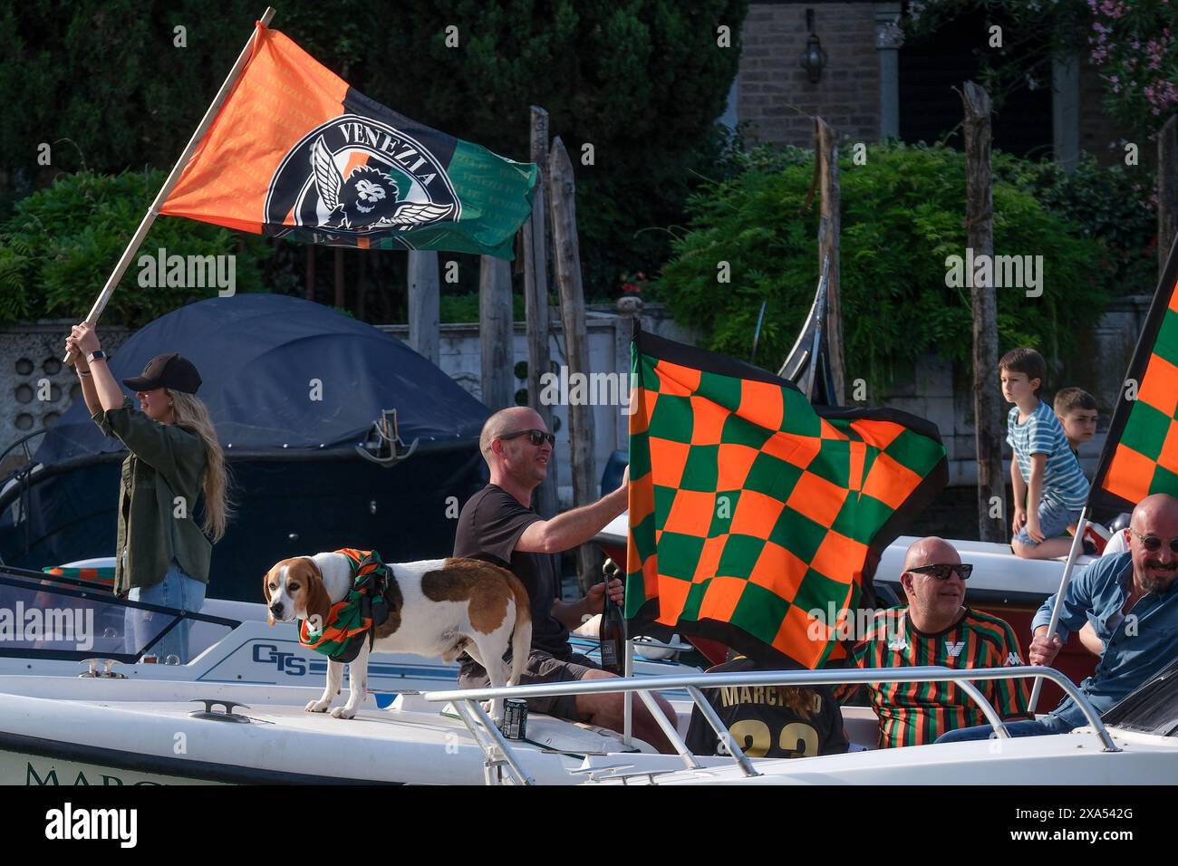 Venezia players celebrate promotion to Serie A with fans on the Grand ...