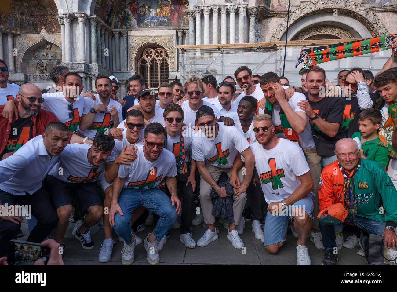 Venezia players celebrate promotion to Serie A with fans on the Grand ...