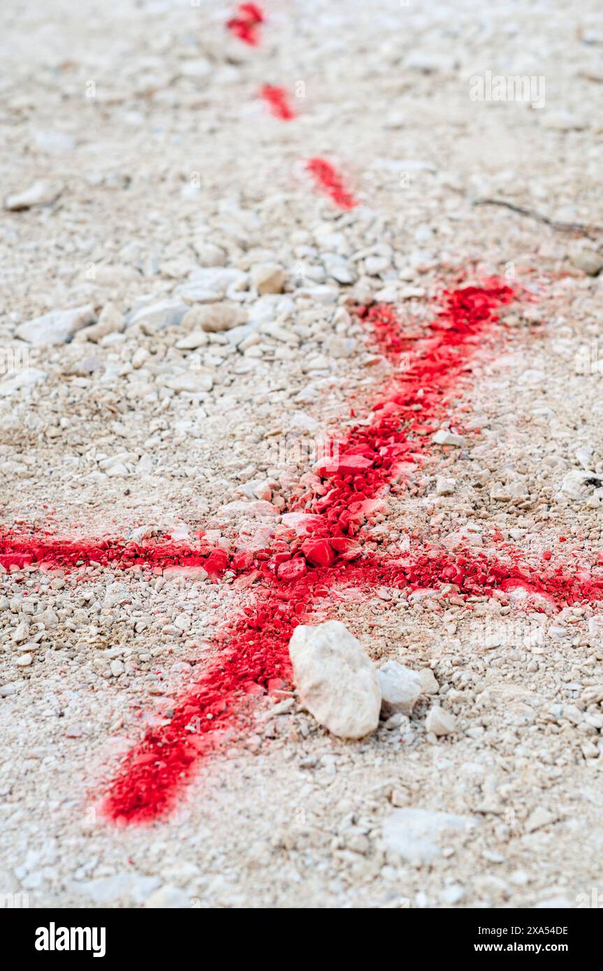 Crushed stone with markings for waste water system at construction site ...