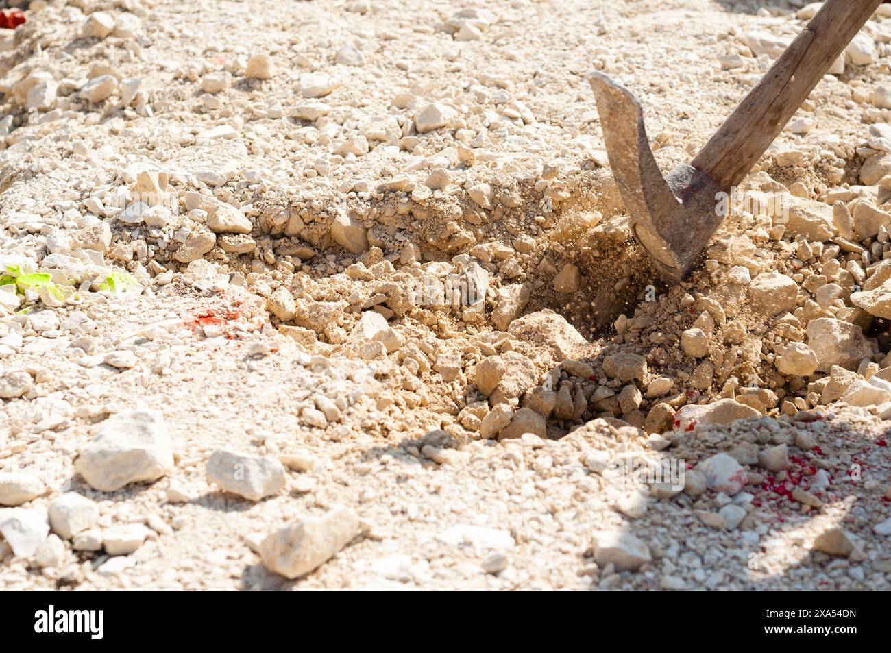The process of digging in crushed stone on a construction site in ...
