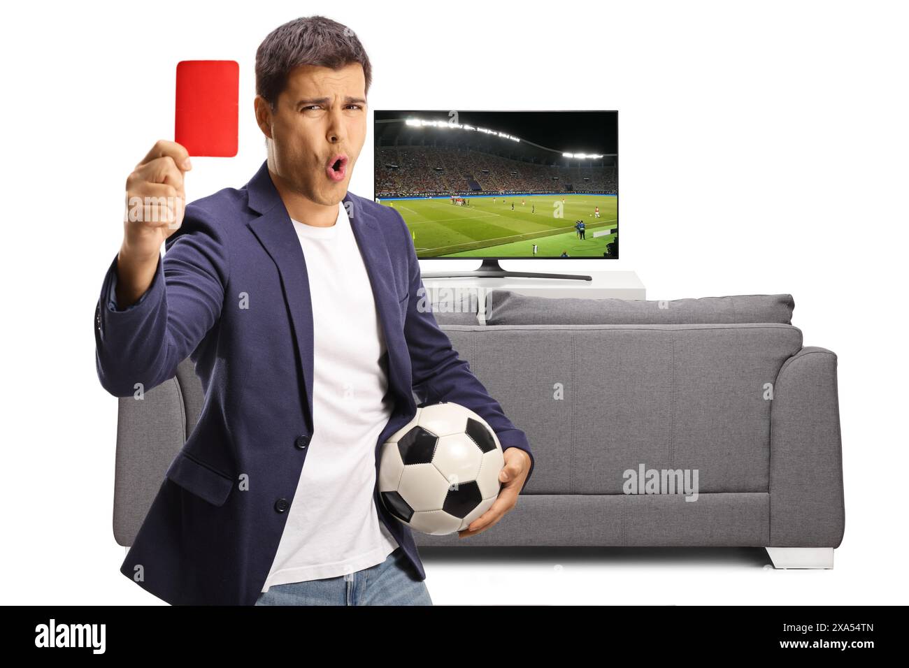 Angry man holding a football and showing a red card in front of a tv ...