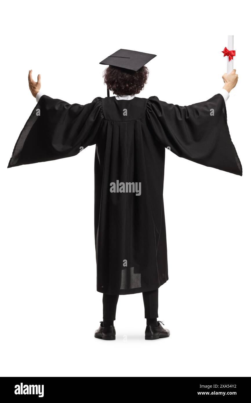 Rear view shot of a happy male student in a graduation gown holding a ...