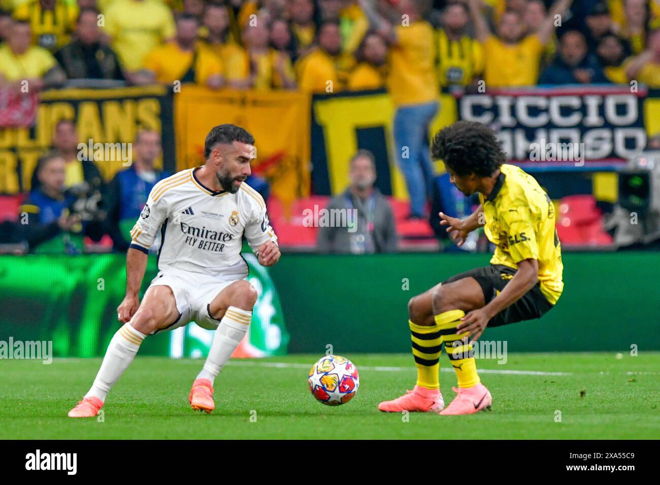 Daniel Carvajal of Real Madrid (L) and Karim Adeyemi of Dortmund (R ...