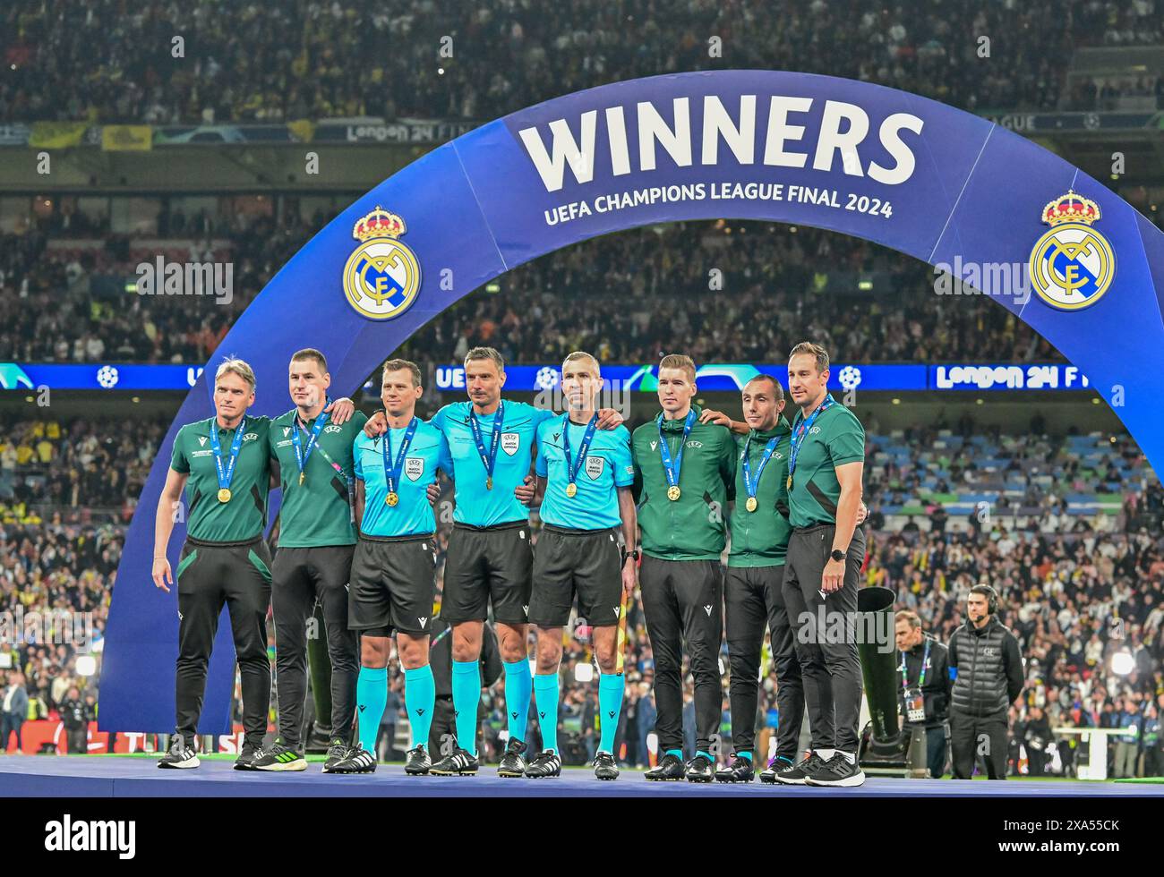 The referee team seen posing after the UEFA Champions League Final 2024 ...