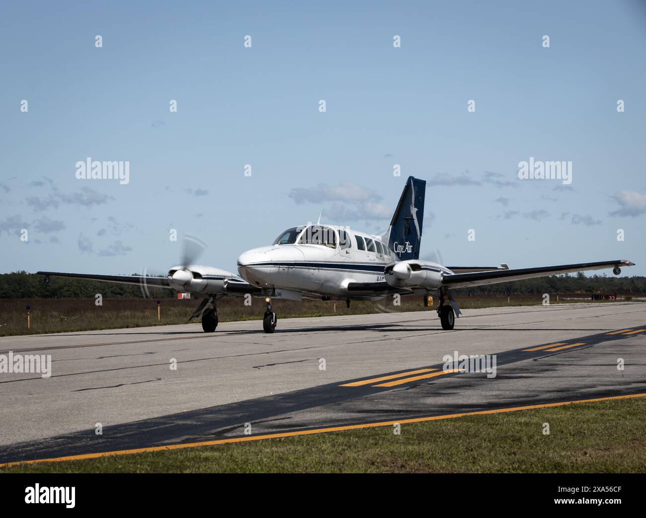 A small propeller plane operated by Cape Air taxiing prior to take off ...