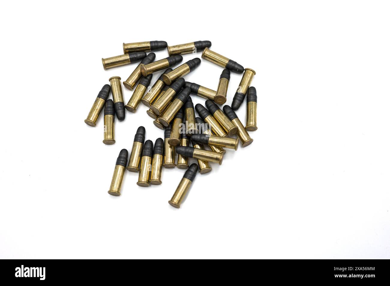 A handful of standard .22 caliber bullets on a white background. .22 LR ...