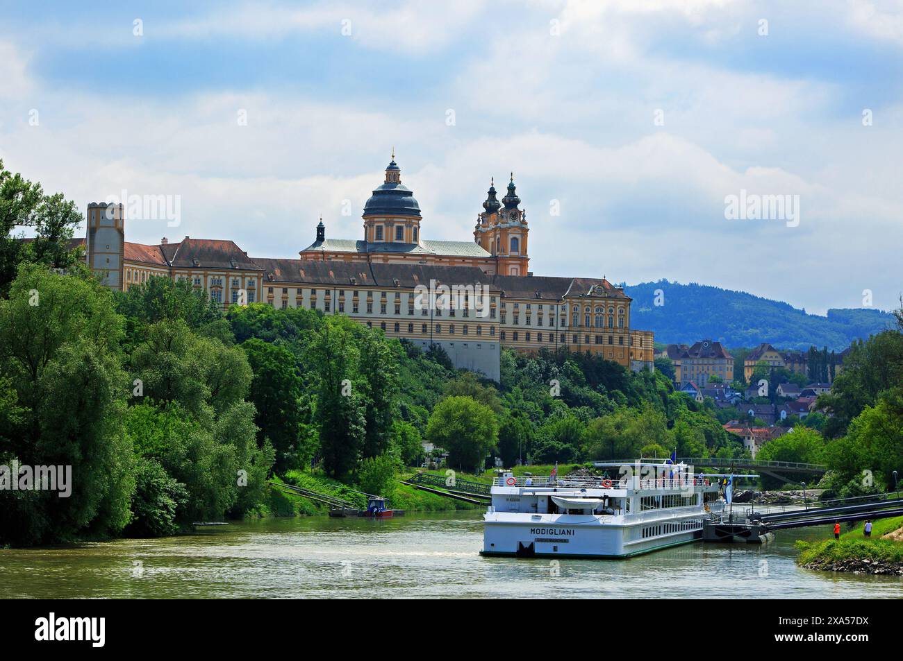 Melk - Austria, 2024. Melk Abbey on the hill with river cruise boat ...