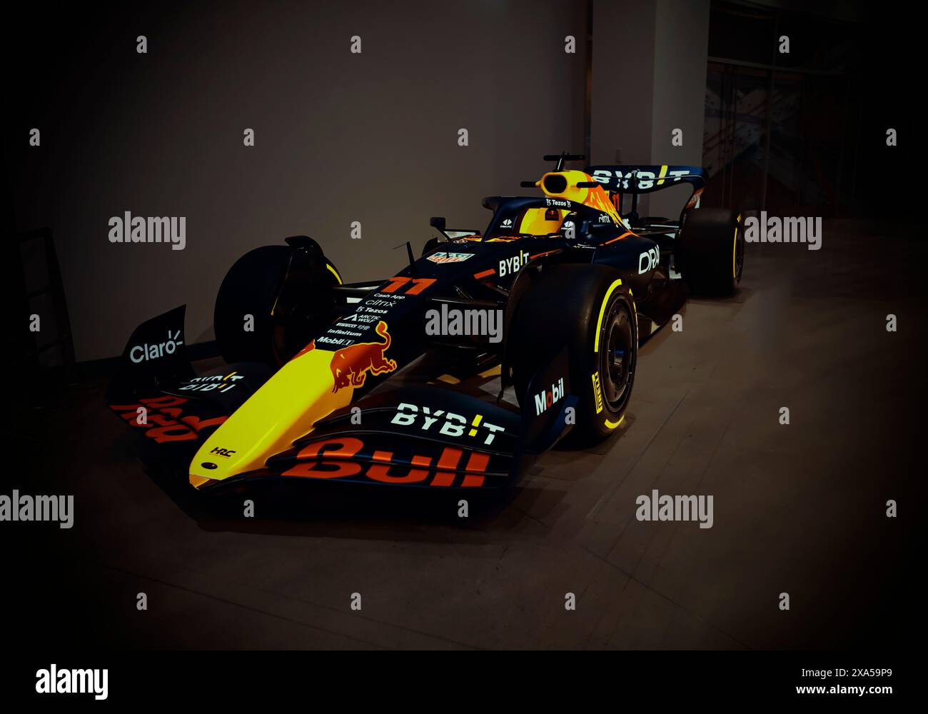 A Red Bull Formula 1 race car, number 11, showcased at an exhibition ...