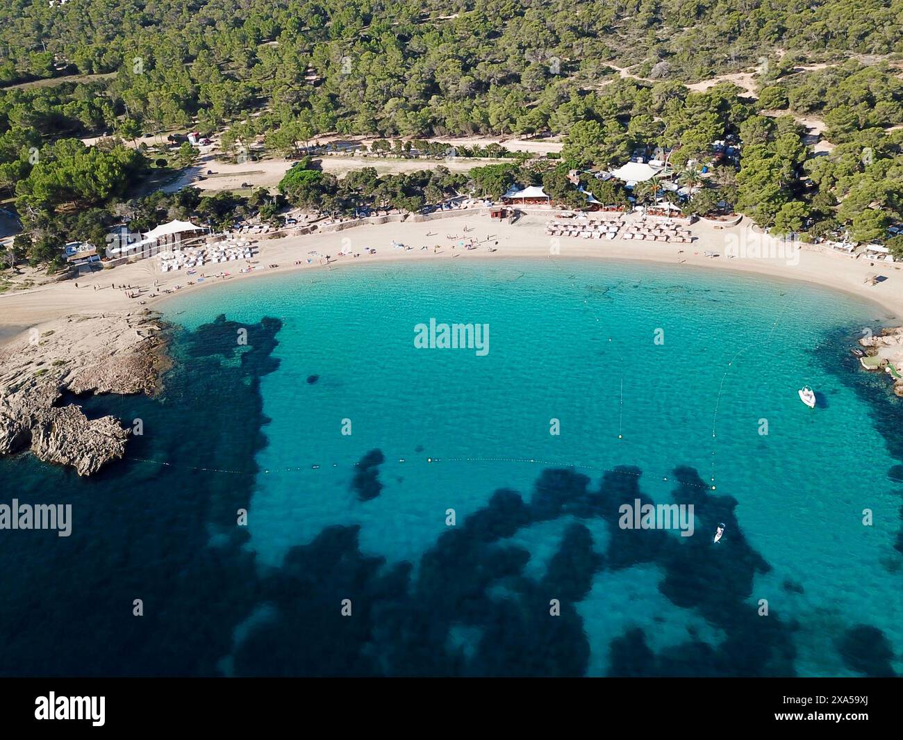 An aerial view of a tropical beach with crystal clear blue water ...