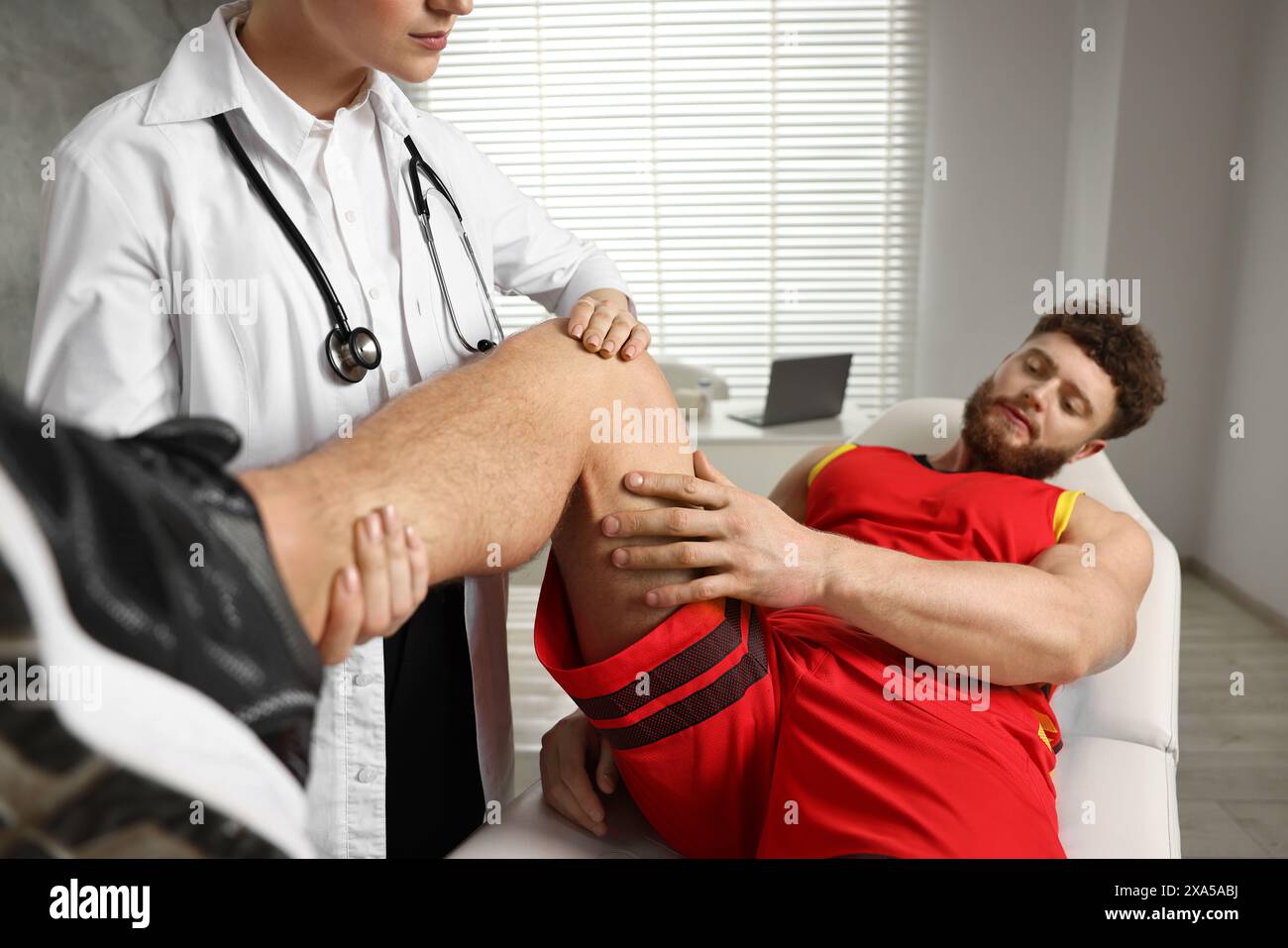 Doctor examining leg in hospital hi-res stock photography and images ...
