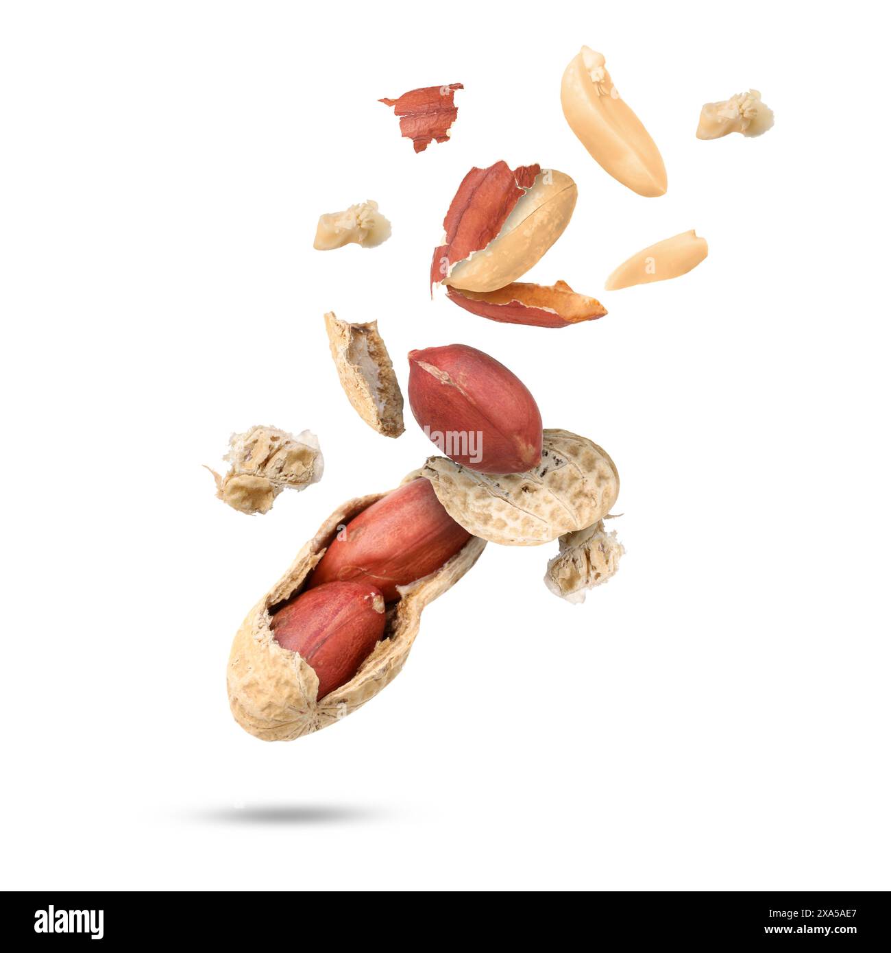 Peanuts and crushed pod in air on white background Stock Photo - Alamy
