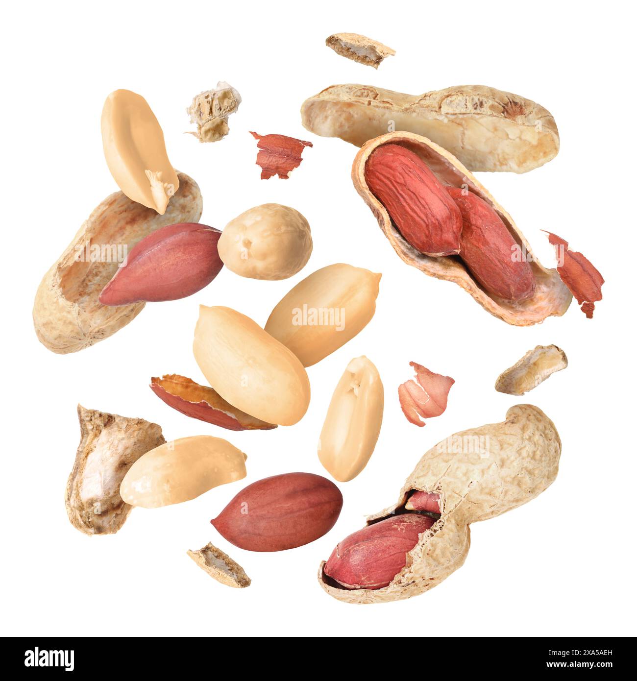 Peanuts and crushed pods in air on white background Stock Photo - Alamy