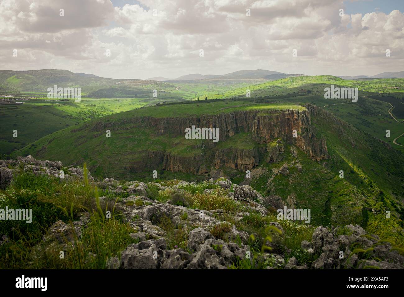 A breathtaking view of the lush green valleys and rocky cliffs of the ...