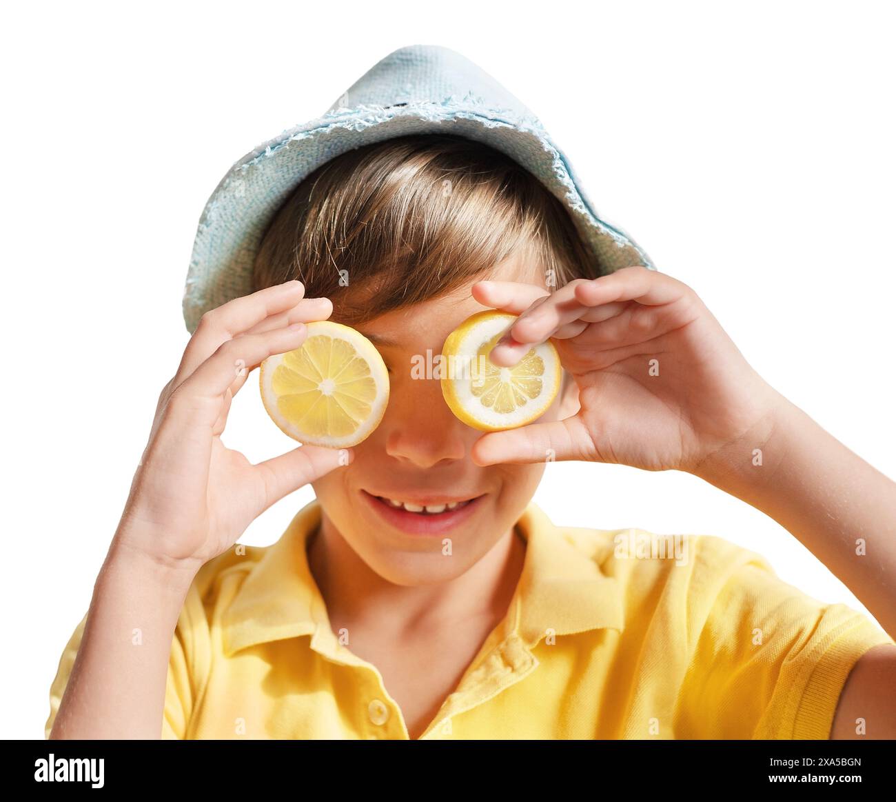 Boy with two halves of lemon as eyes and summer hat isolated on a white ...