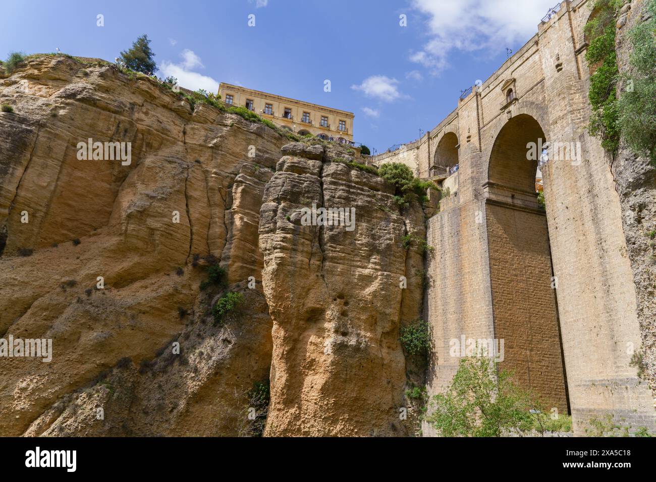 A new bridge over the cliff with a waterfall of the river Guadalevin in ...