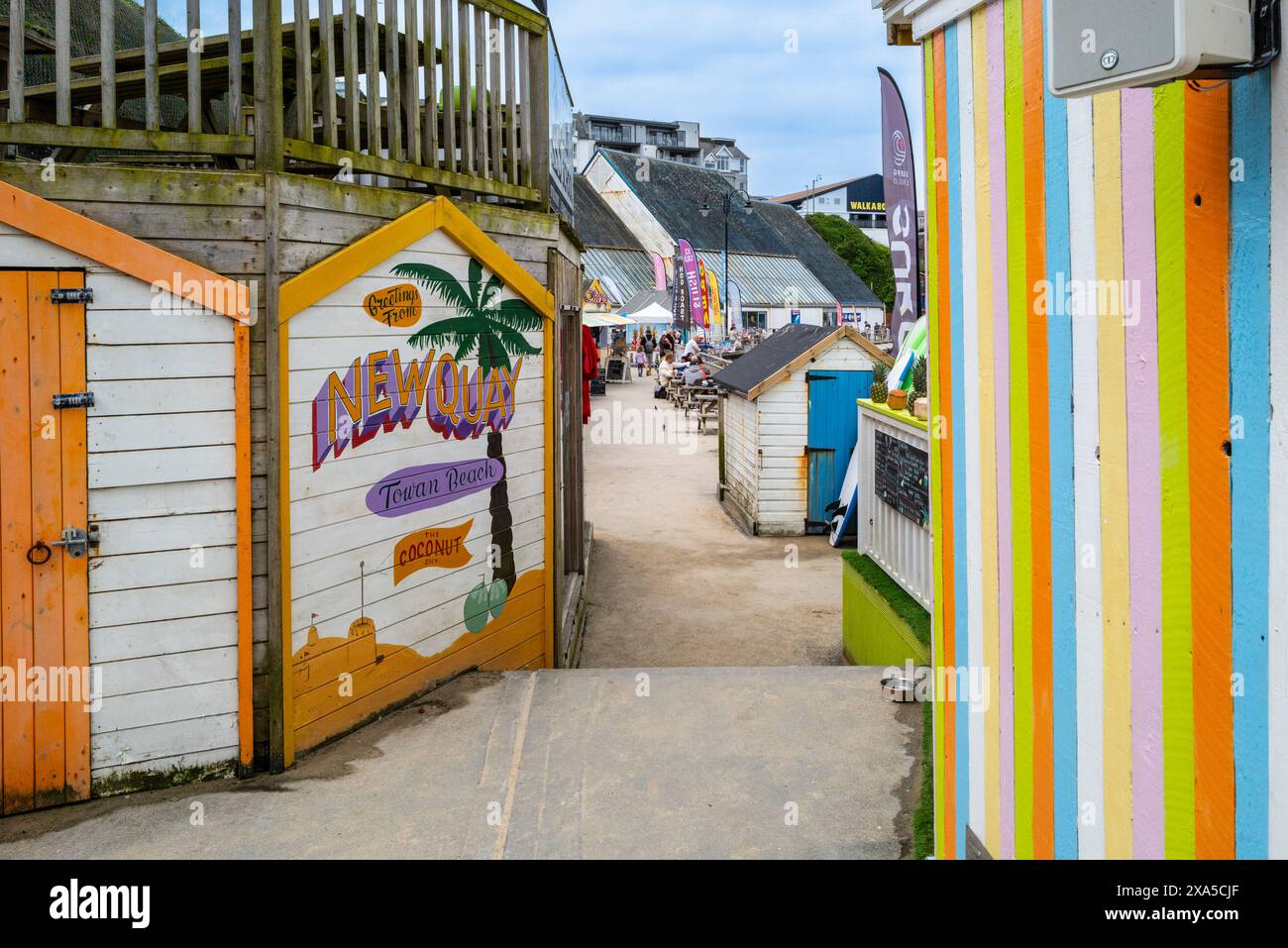 Scruffy wooden painted buildings on Towan Beach promenade in Newquay in ...