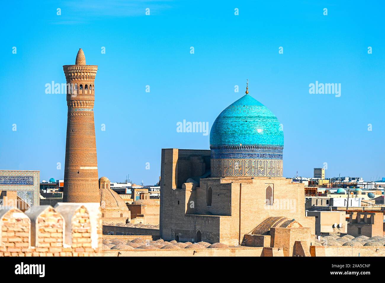Old Town of Bukhara with traditional blue Dome and Kalyan Minaret in ...