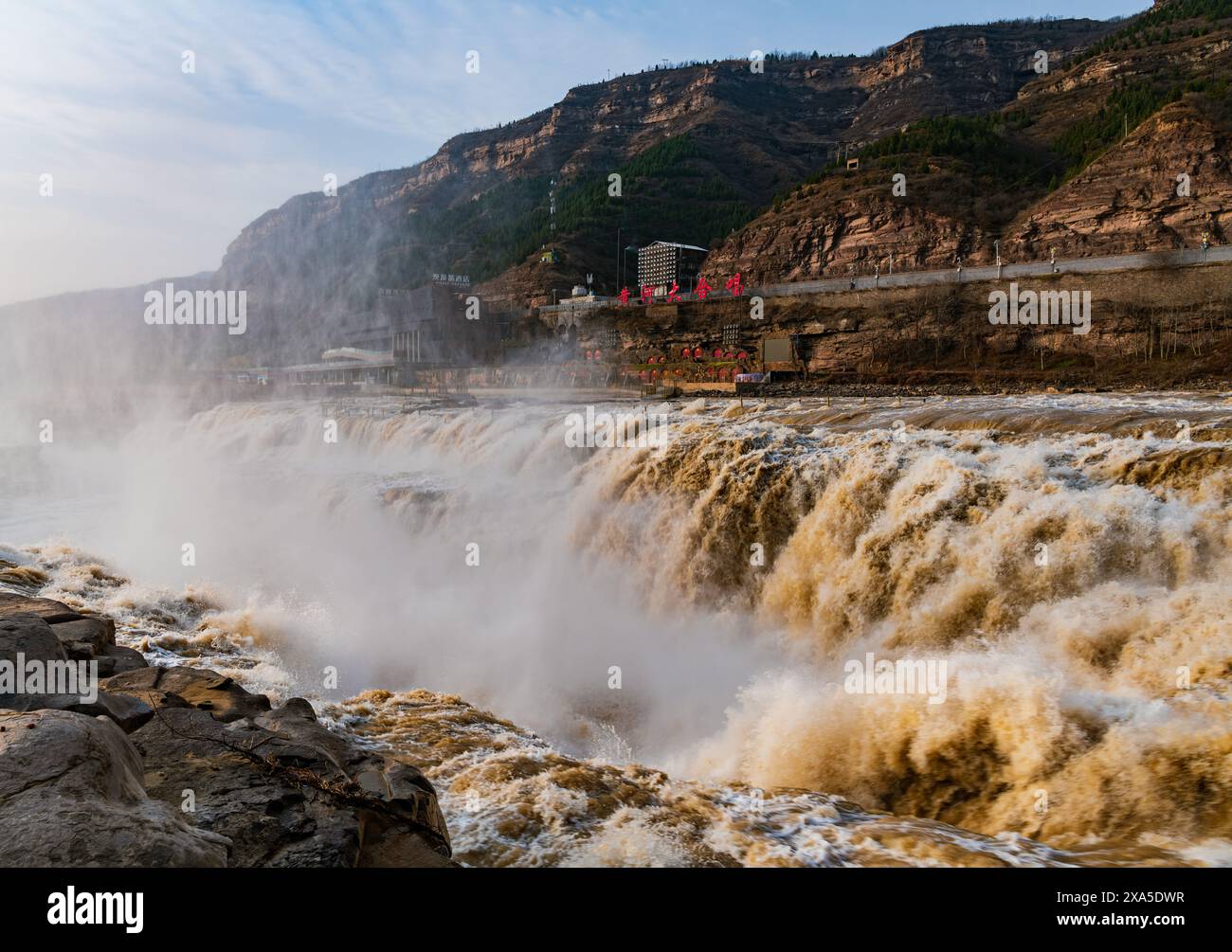 Water gushing down river from dam in powerful flow Stock Photo - Alamy