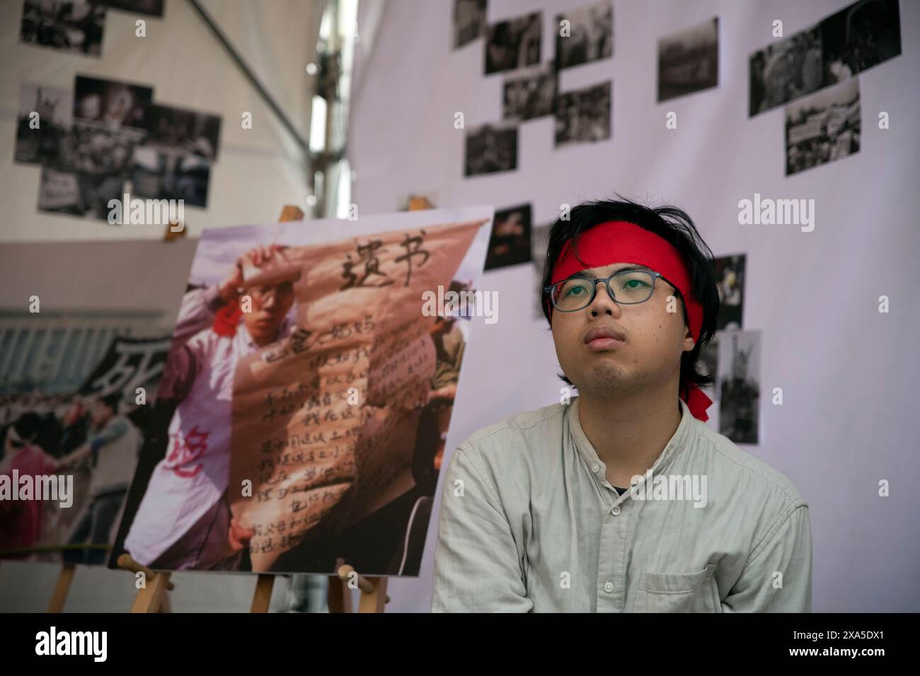 Taipei, Taiwan. 4th June, 2024. A man in a tent with photos taken ...