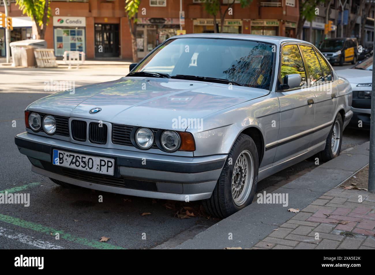 Front detail of an old premium car BMW 520i 5 series generation E34 in ...