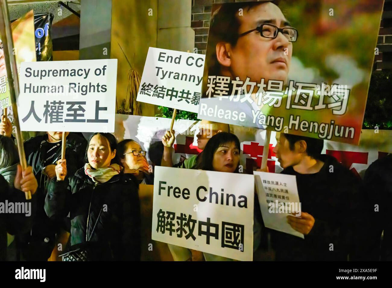 Protester hold "Free China", "Supremacy of Human Rights", "Release Yang ...